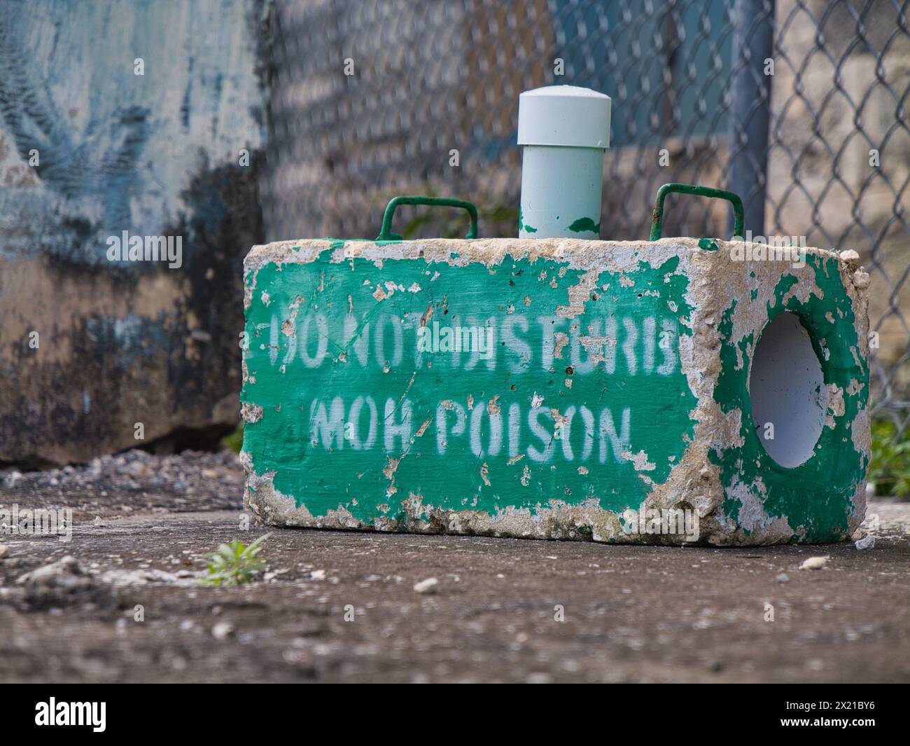Bridgetown, Barbados - Jan 28 2024: A green, worn vermin poison bait ...