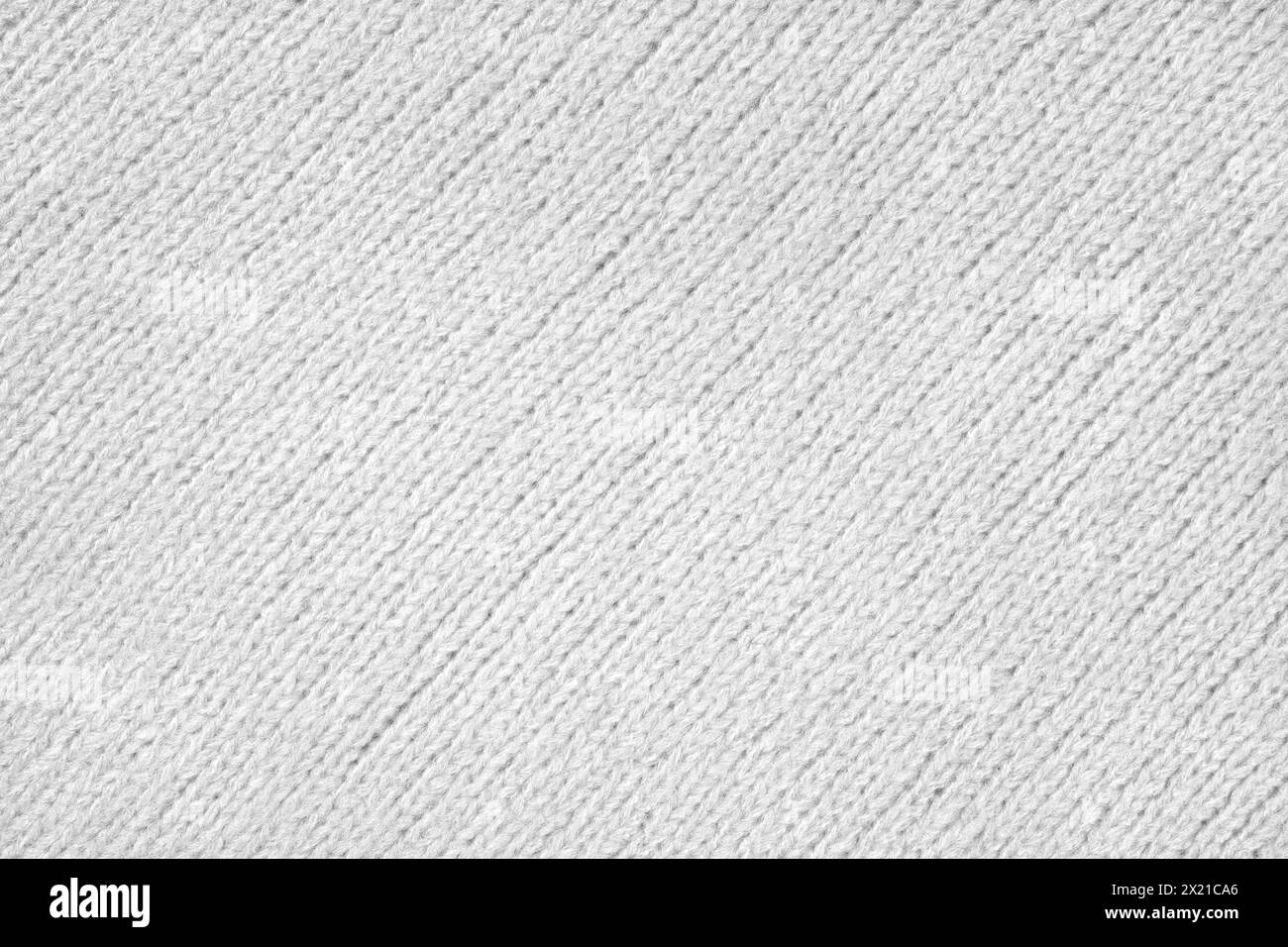 White knitted woolen jersey fabric with diagonal weaving, sweater ...