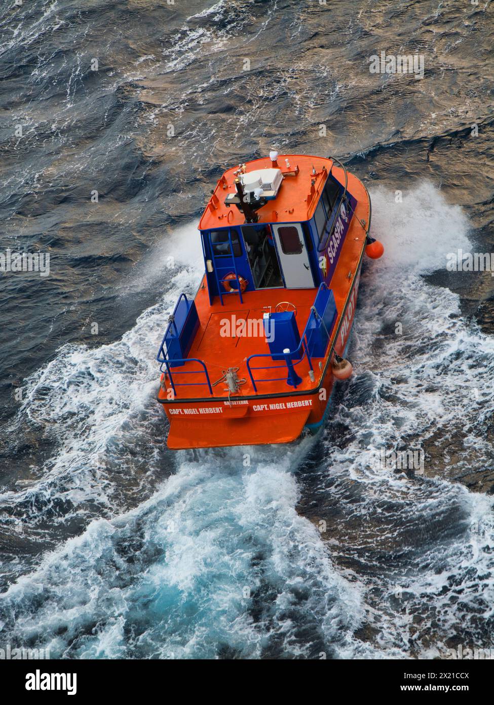 St Kitts: Jan 25 2024: An aerial view of the orange SCASPA Pilot boat ...