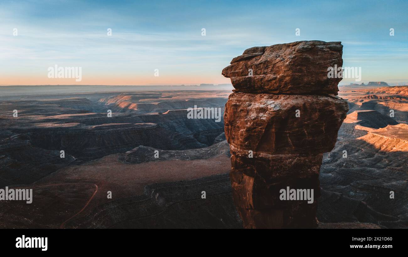 Pillar of sandstone in desert at sunrise, Muley Point, Utah Stock Photo ...