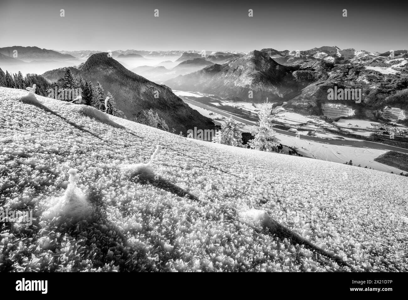 Fresh snow with hoarfrost crystals and view of Kranzhorn and Inntal ...