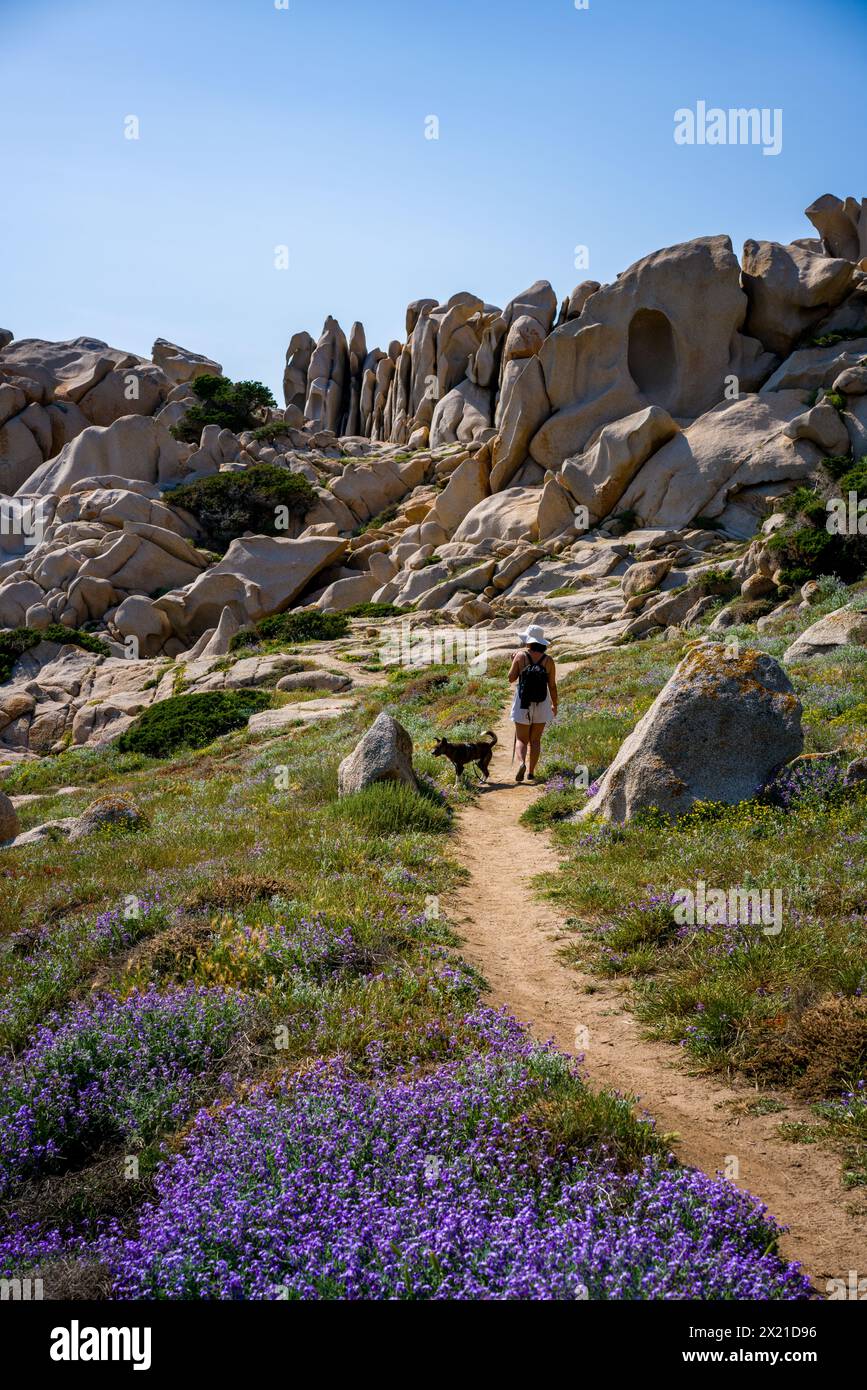 Woman walking on footpath back hi-res stock photography and images - Alamy