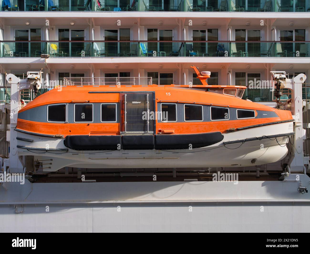 Philipsburg, St Maarten: A single, orange, enclosed life boat on a ...