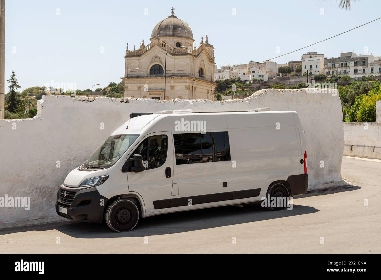 Large volume camper van parked in a nice Italian villageTransport ...