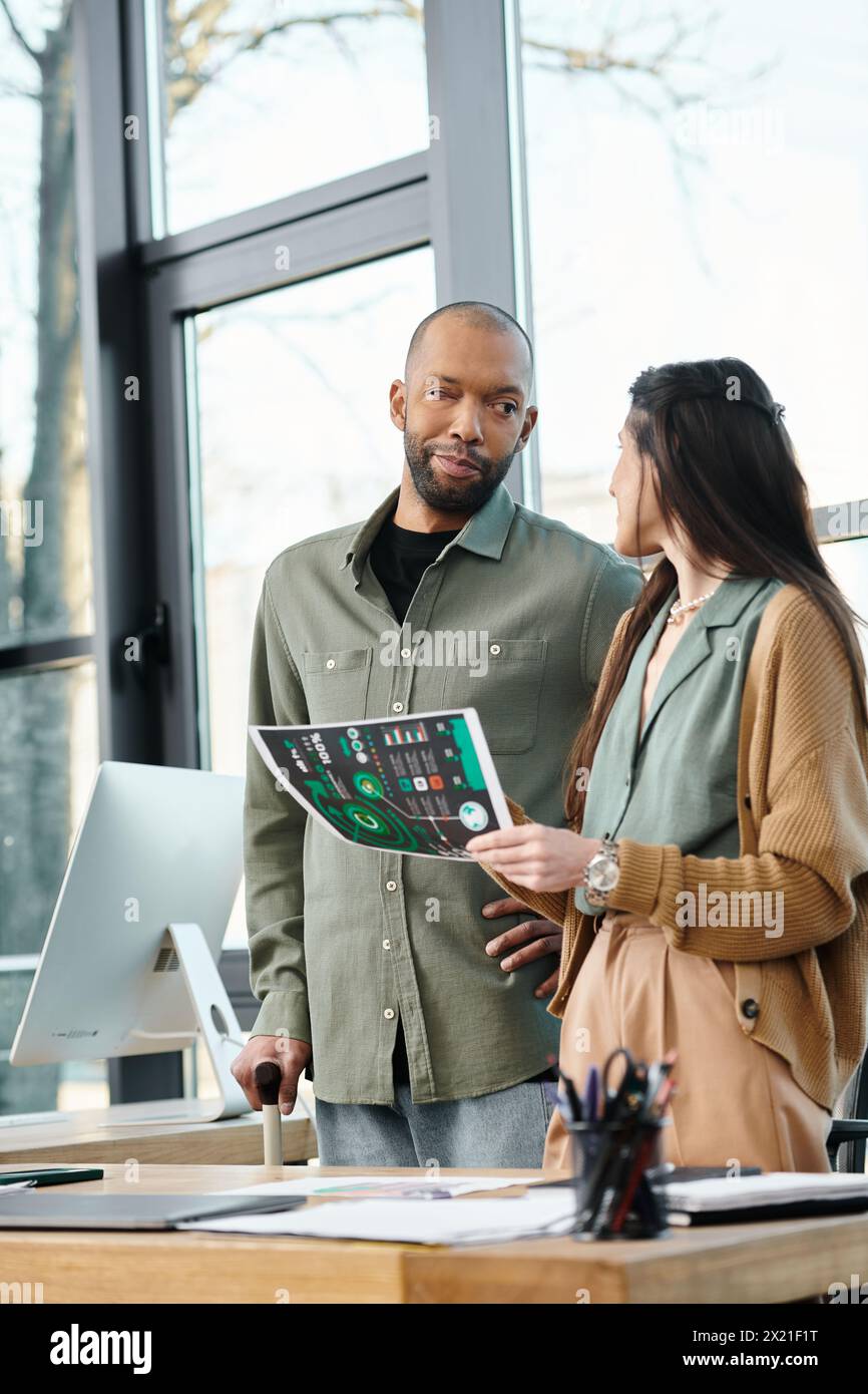 A man with myasthenia gravis and a woman collaborating on a map inside ...