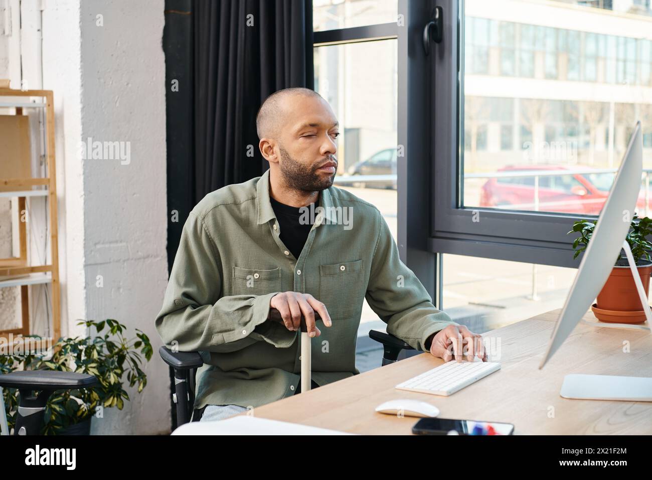 A disabled african american man with myasthenia gravis focused on his ...