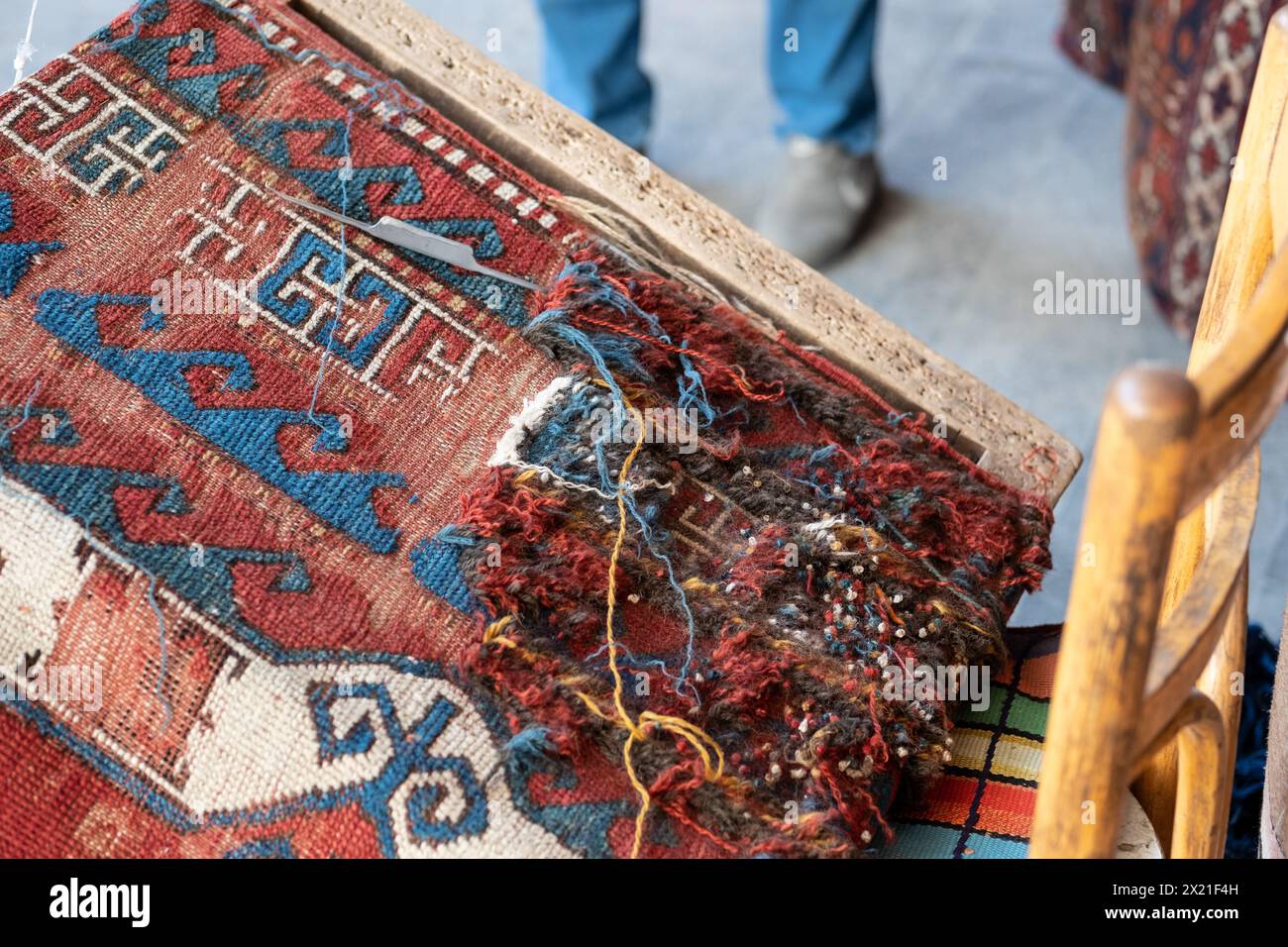 Detail of yarn ends of carpet during restoration threadbare Stock Photo ...
