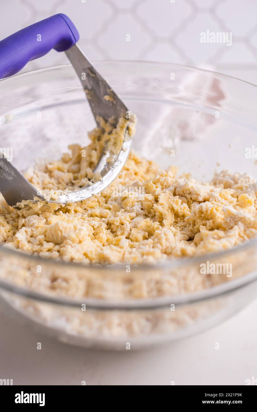 Mixing pastry dough with a pastry blender Stock Photo - Alamy