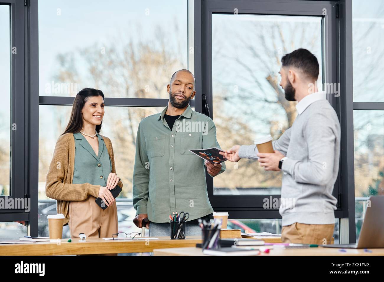A diverse group of professionals brainstorming around a table in an ...