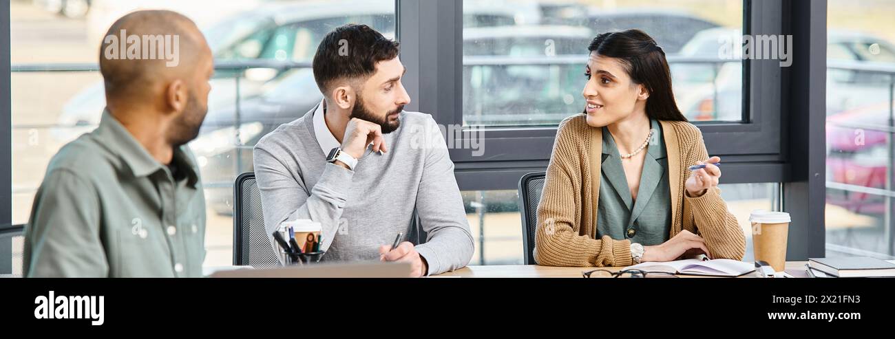 A diverse group of professionals engage in a lively discussion around a ...