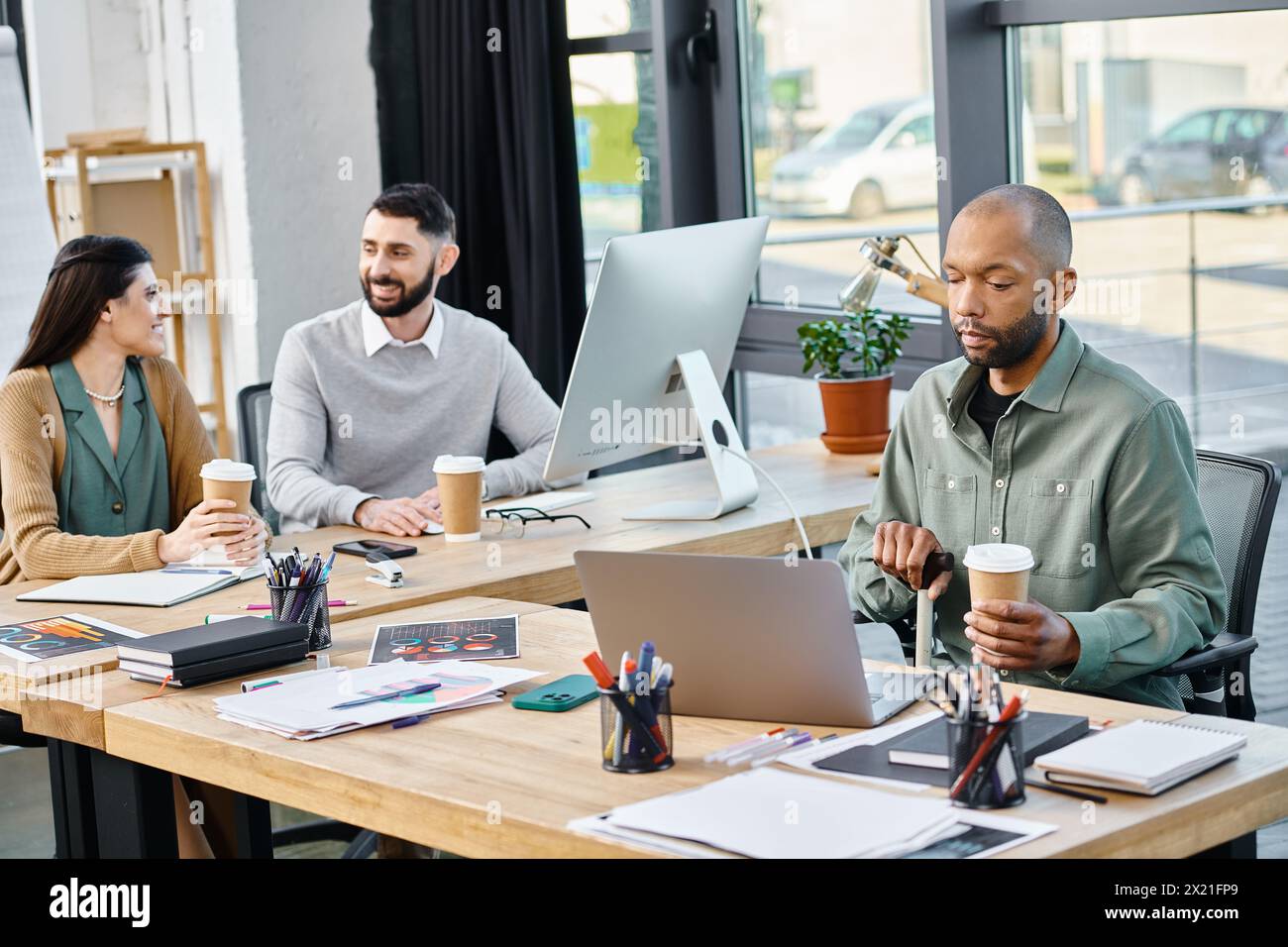 A diverse group of professionals brainstorming and collaborating on ...