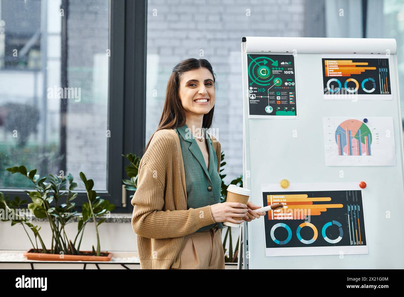 A businesswoman standing confidently in front of a whiteboard, leading ...