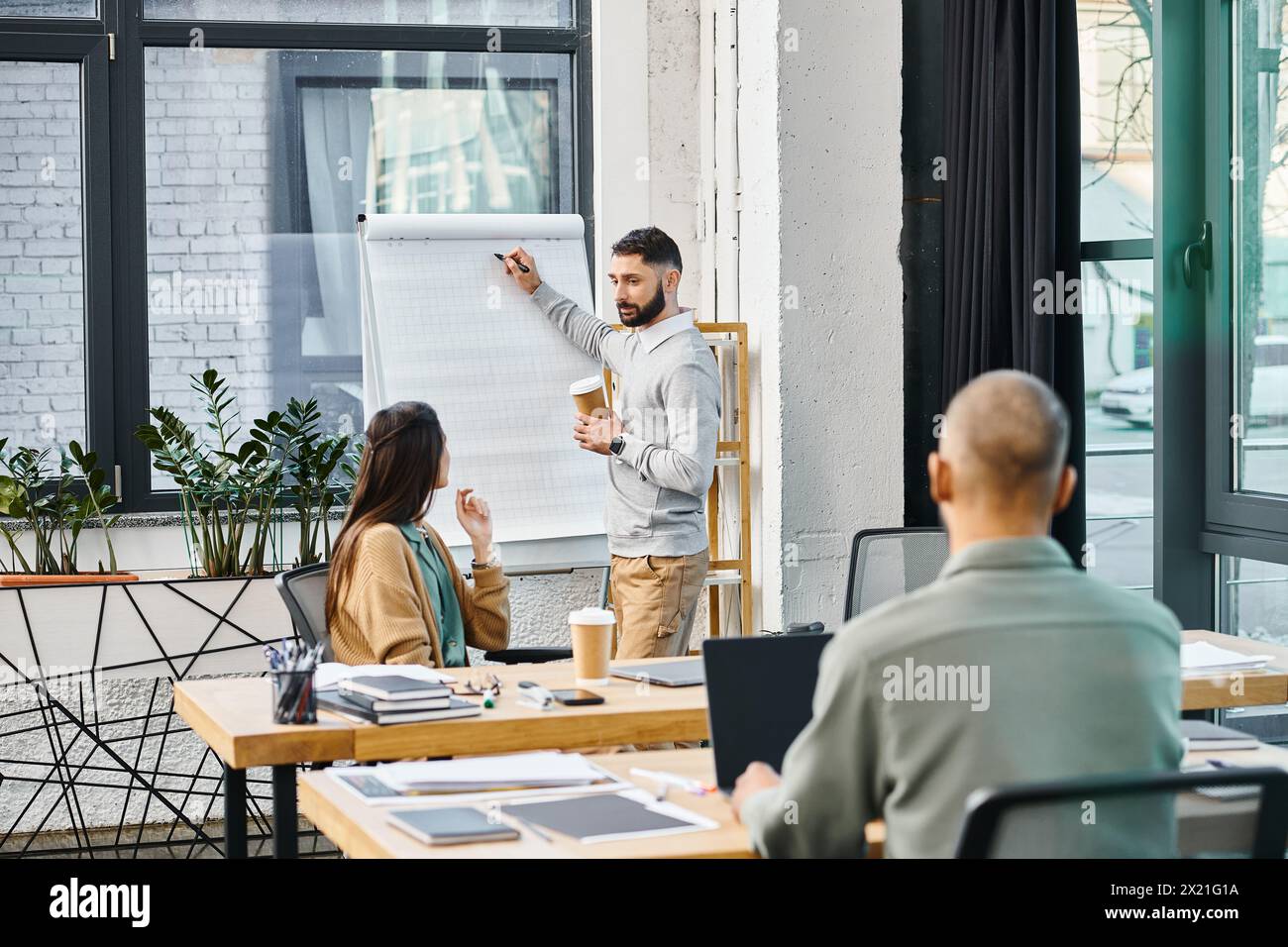 A diverse group of professionals collaborating around a table in an ...