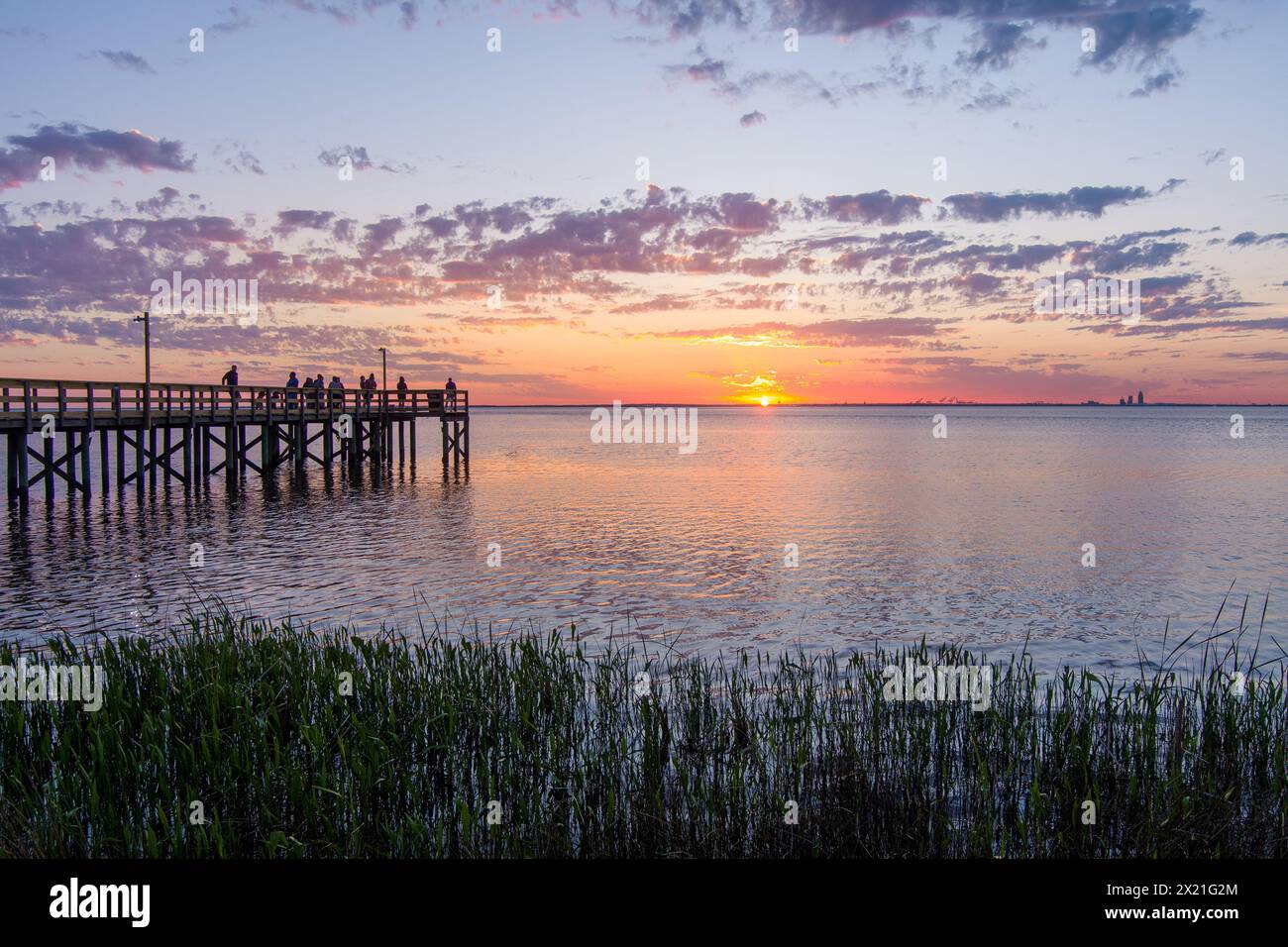 Beautiful sunset at Mobile Bay Stock Photo - Alamy