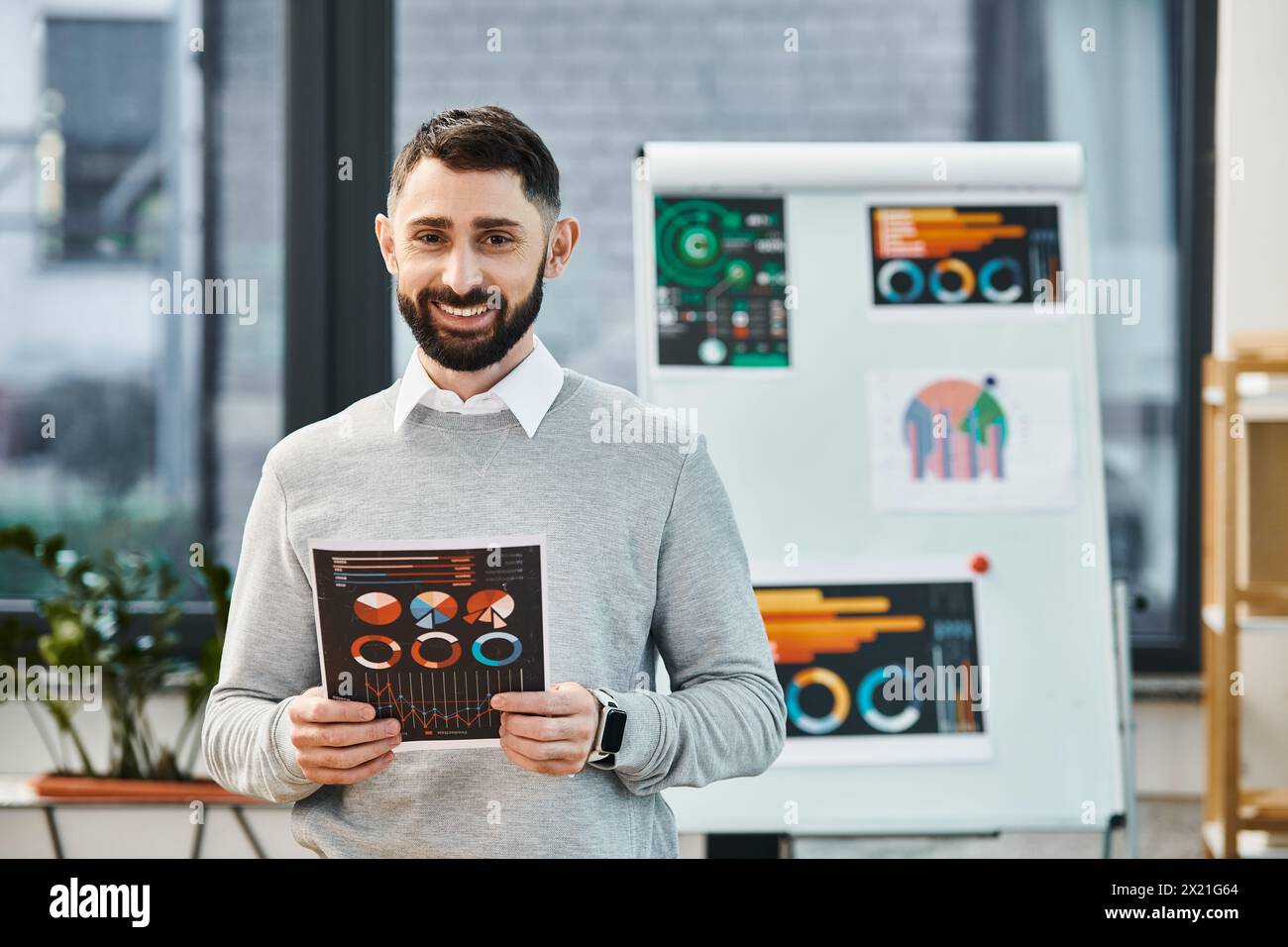 Business man holding charts graphs hi-res stock photography and images ...