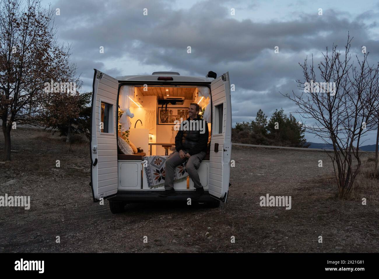Man sitting in back van hi-res stock photography and images - Alamy
