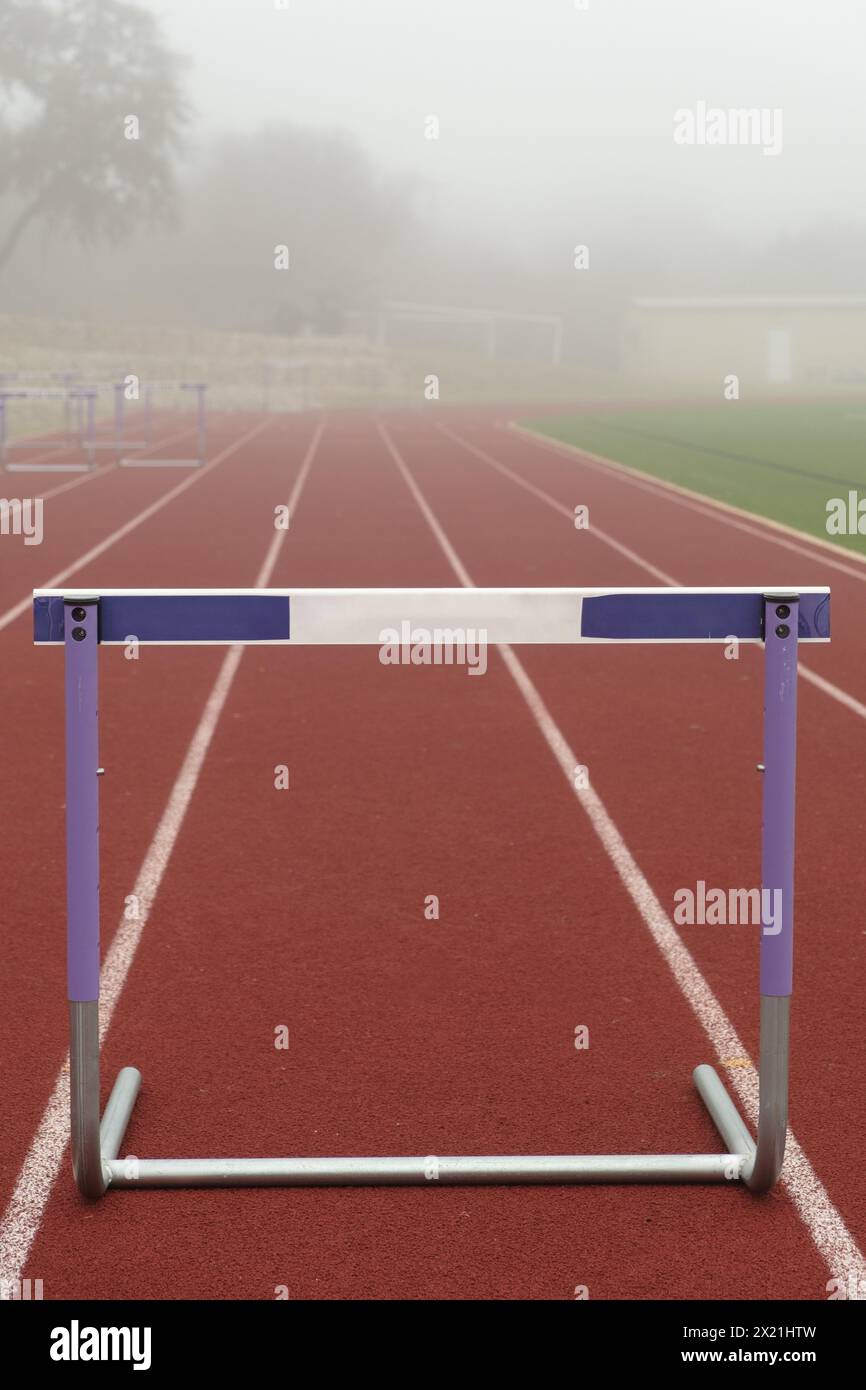 Single Purple and White Hurdle on Track Stock Photo - Alamy