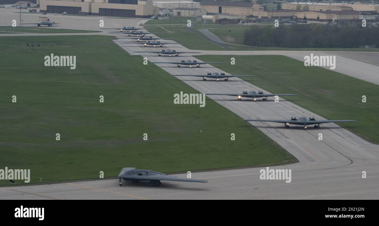 B-2 Spirit stealth bombers assigned to the 509th Bomb Wing taxi on the ...