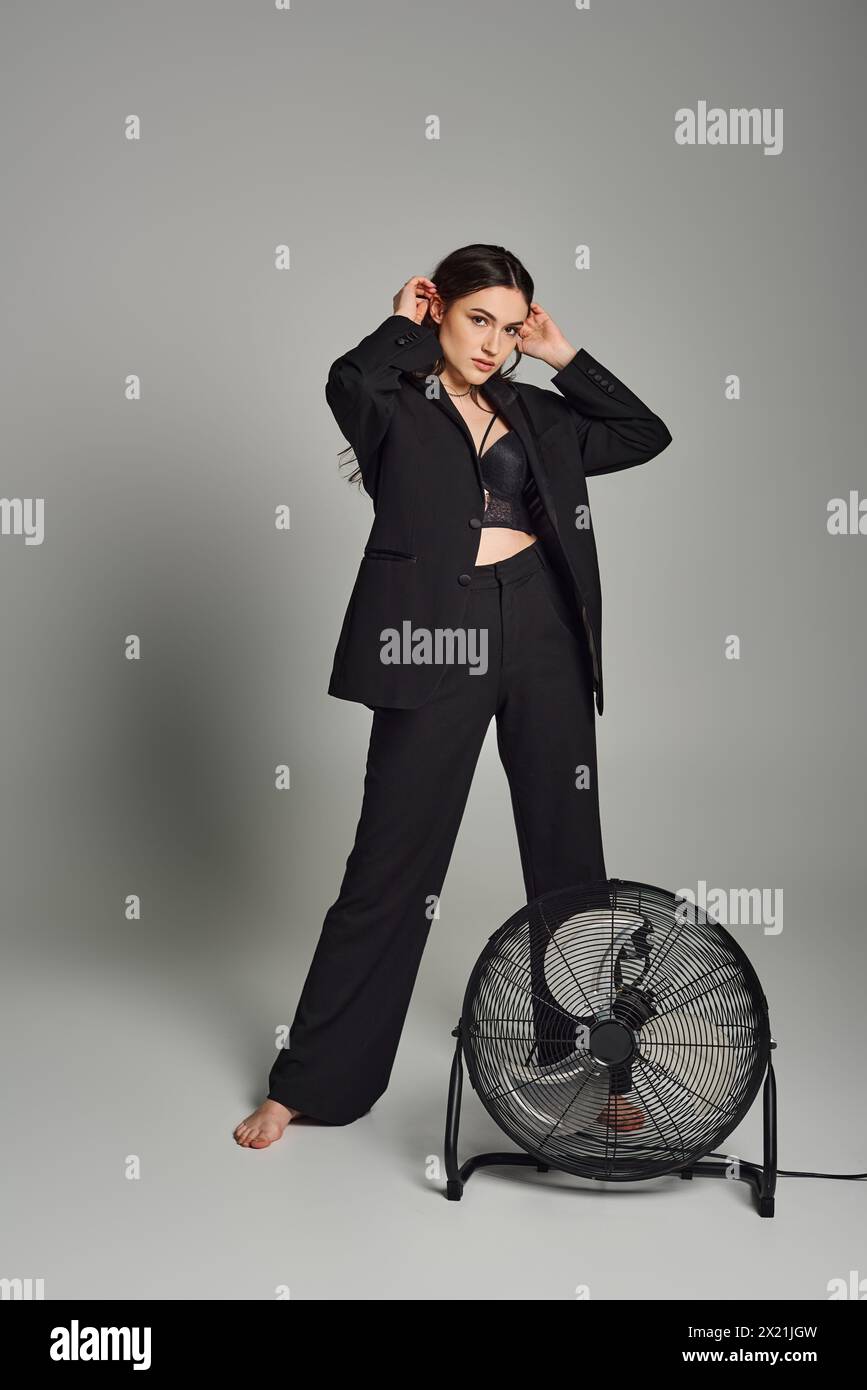 A plus-size woman exudes confidence in a stylish suit, standing ...