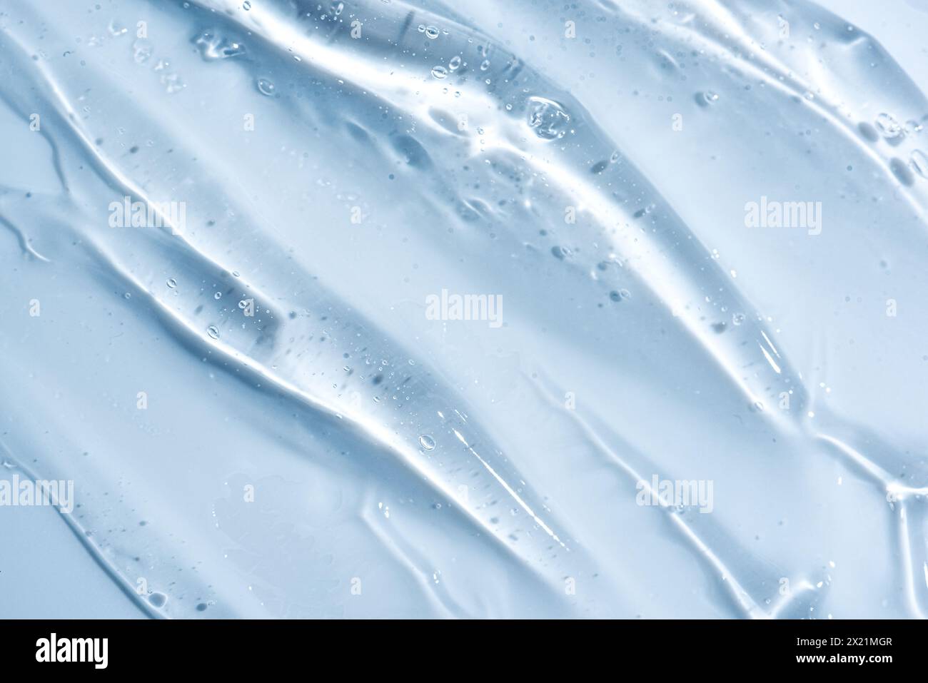 Clear cosmetic gel texture close up. Acid face serum, sanitizer gel ...