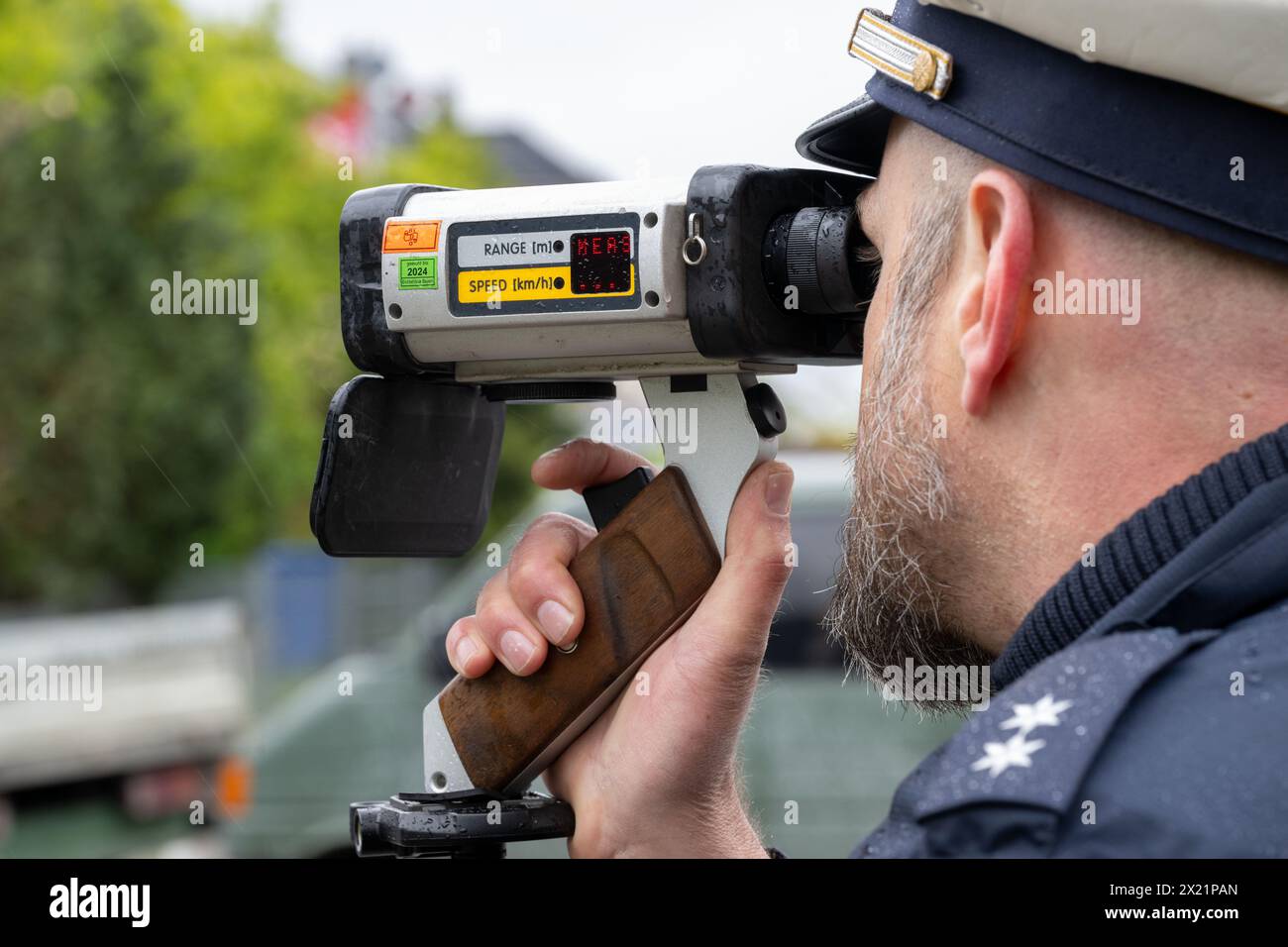 Nuremberg, Germany. 19th Apr, 2024. A police officer looks through a ...
