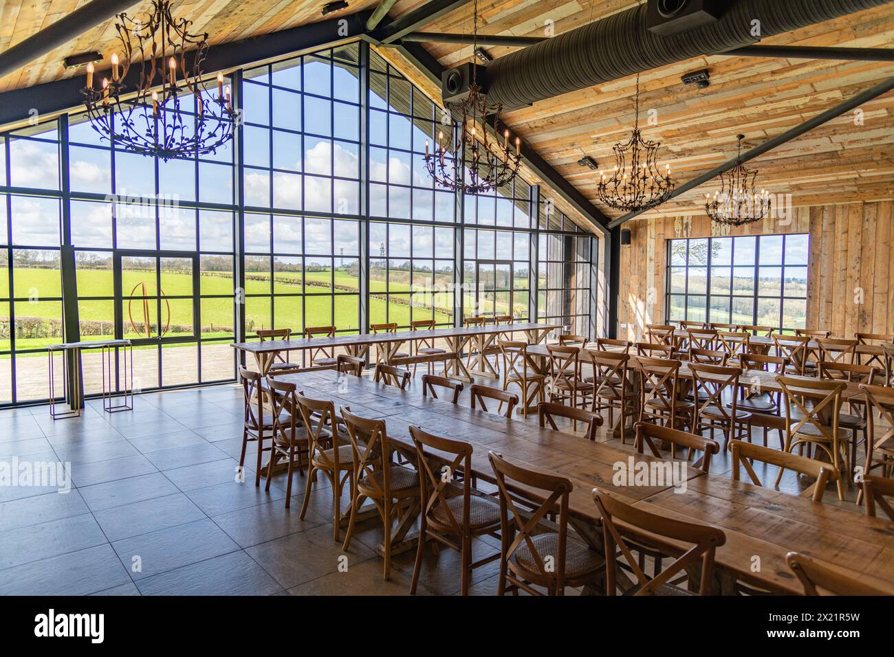 Laid out dinner tables for a wedding reception at Botley Hill Farm in ...