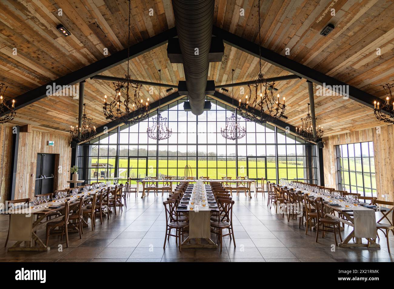 Laid out dinner tables for a wedding reception at Botley Hill Farm in ...