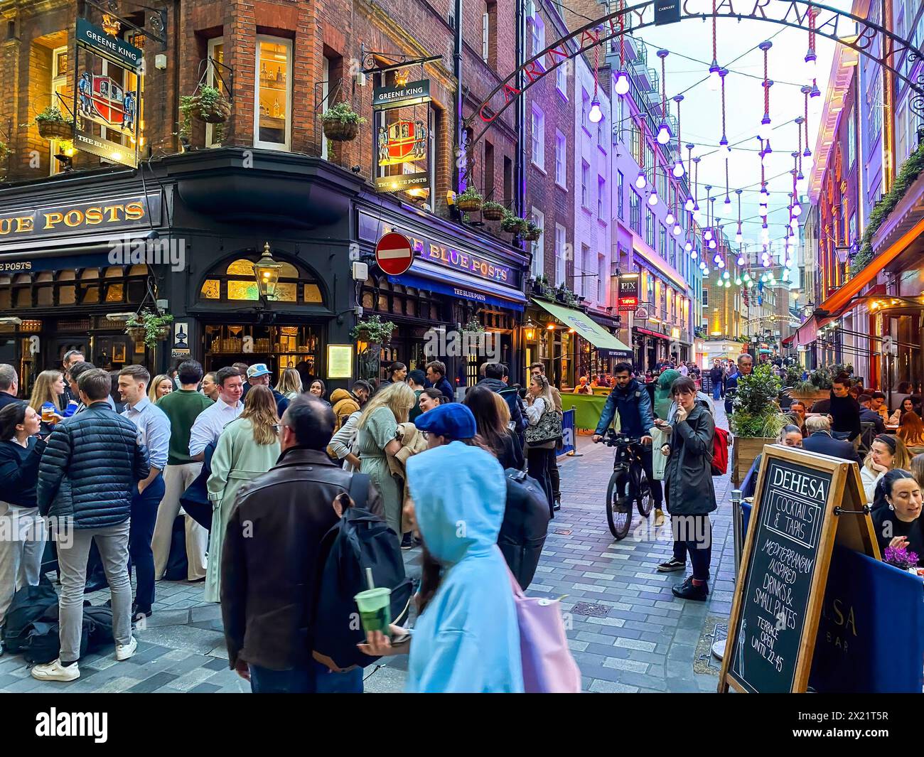 April 11, 2024, London, United Kingdom: People gather outside pubs on ...