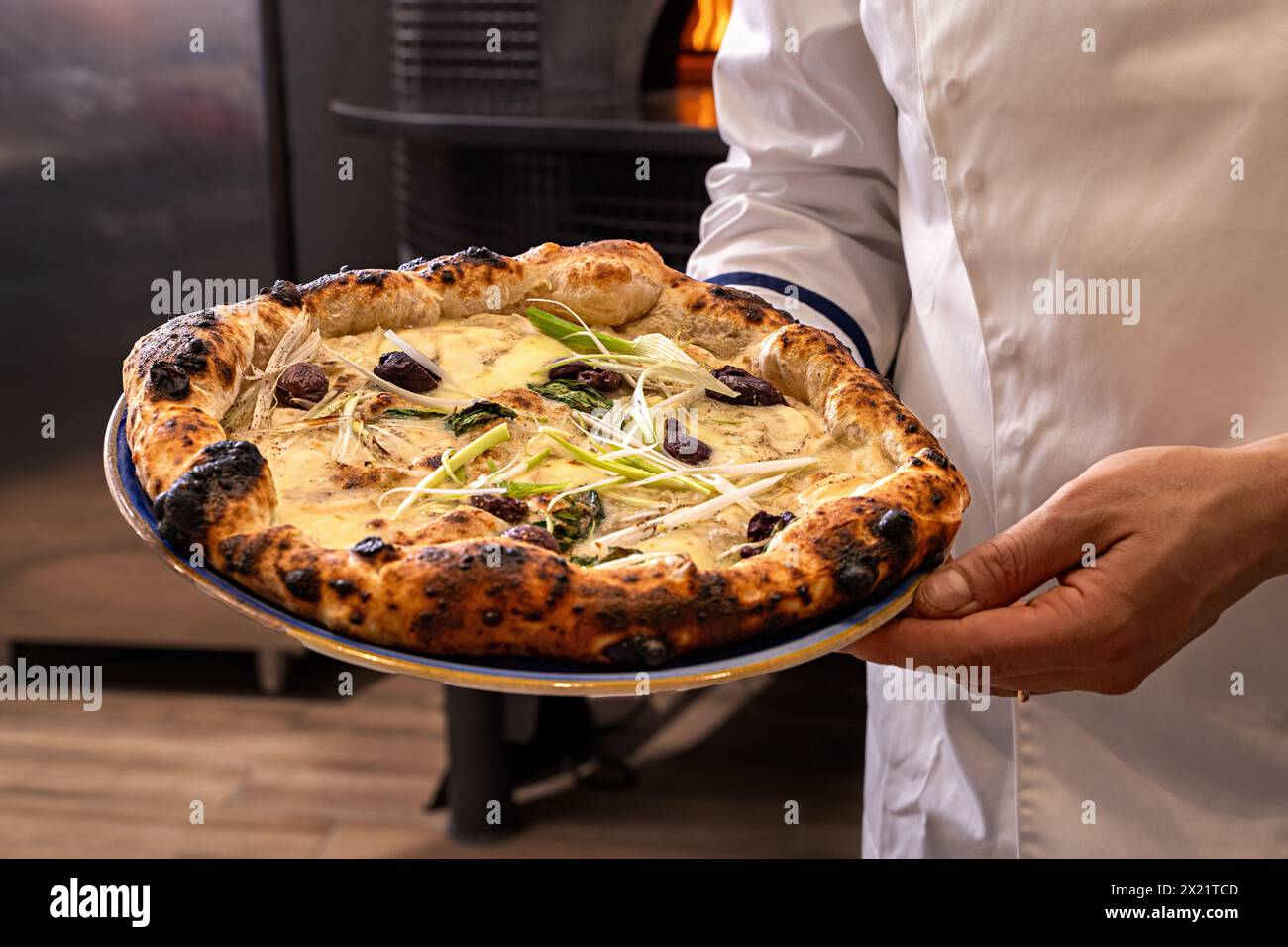 Italian pizza presentation - A chef presents a Neapolitan pizza ...