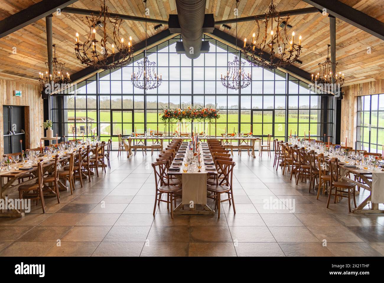 Laid out dinner tables for a wedding reception at Botley Hill Farm in ...