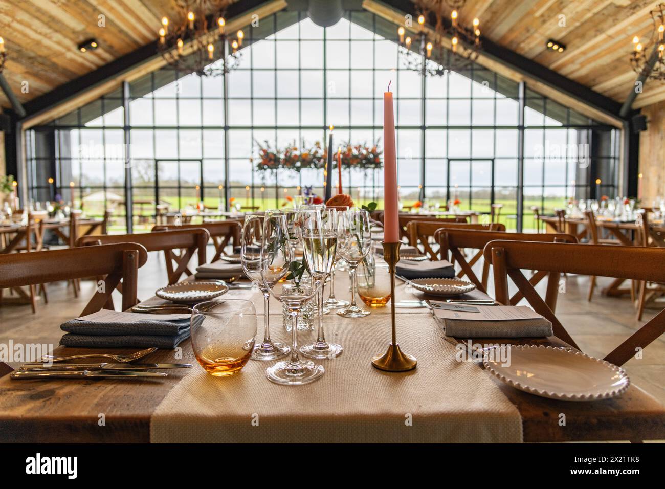 Laid out dinner tables for a wedding reception at Botley Hill Farm in ...