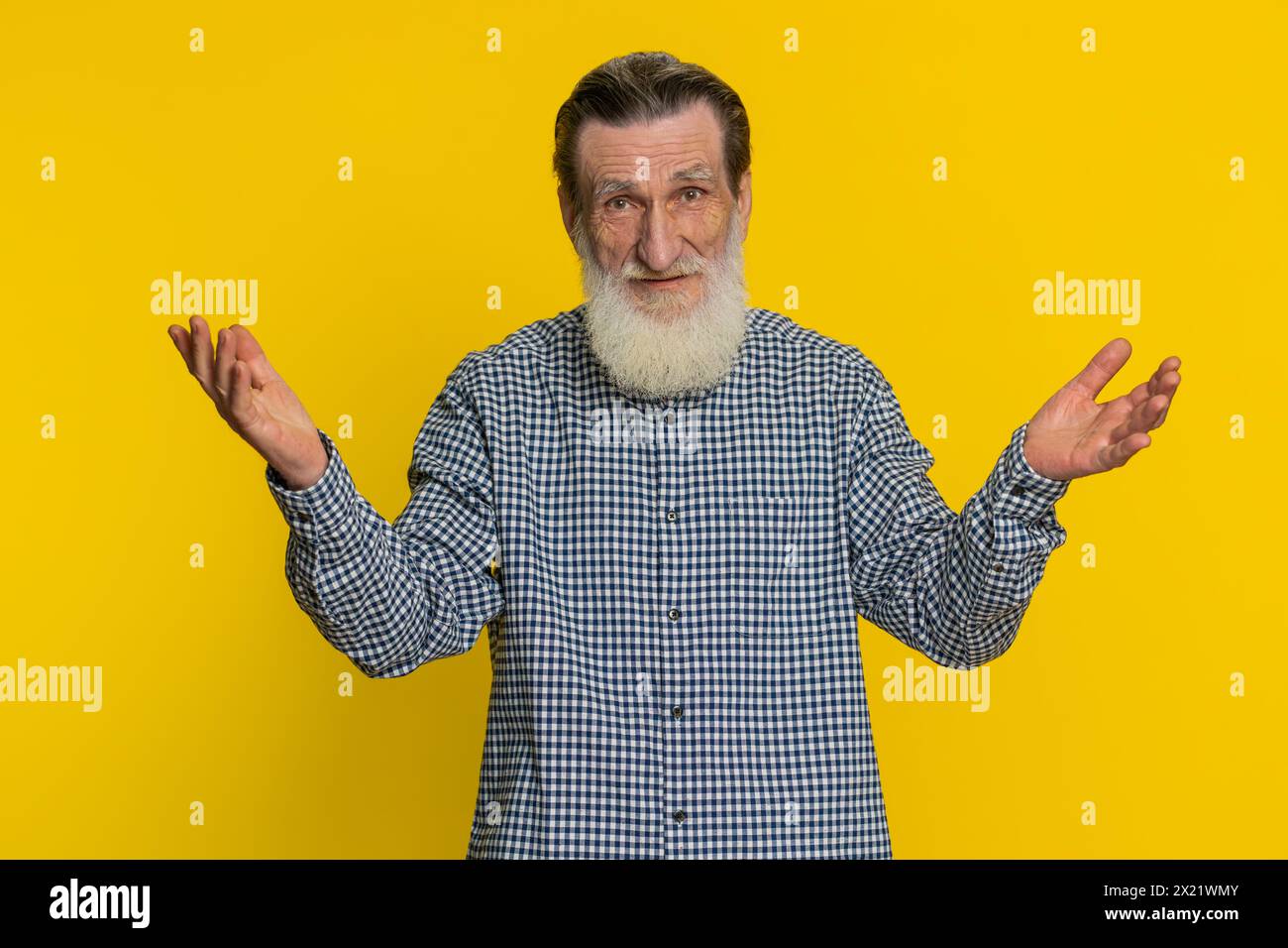 What. Why. Angry senior man raising hands in indignant expression ...