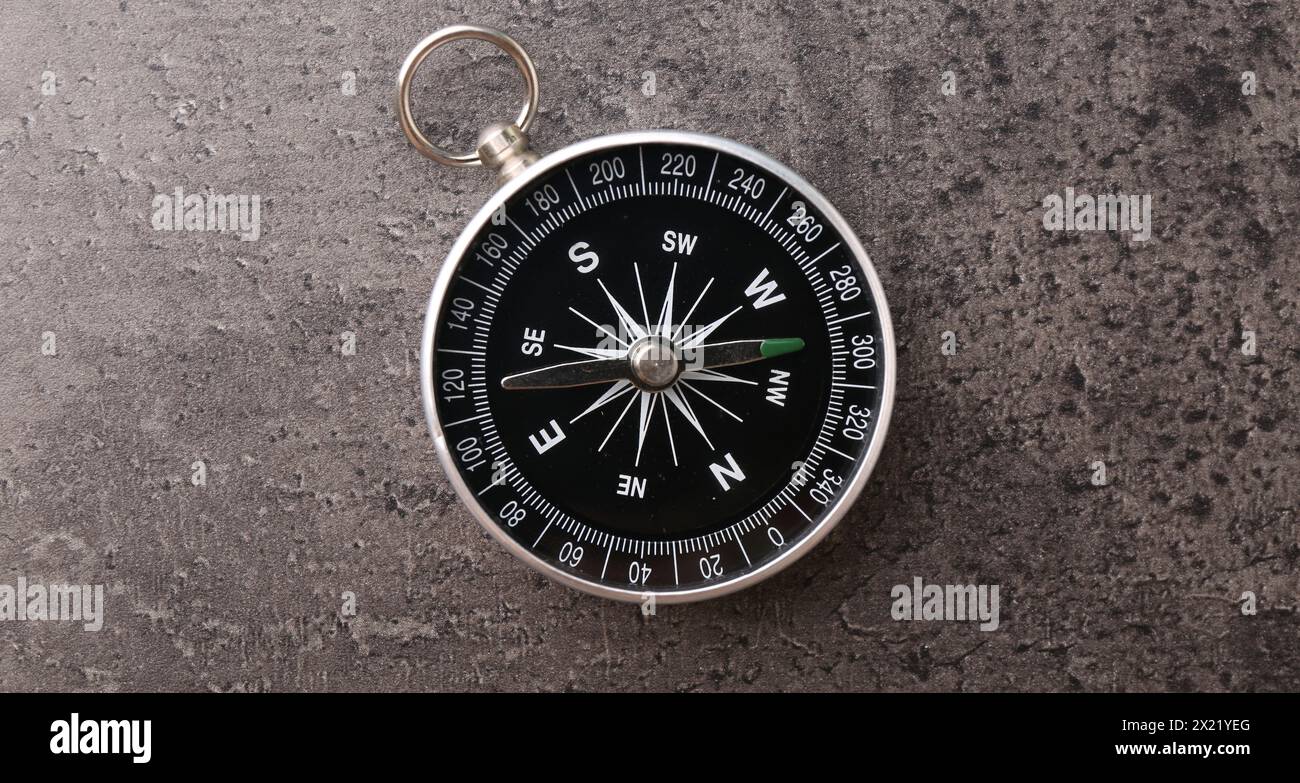 One compass on grey hi-res stock photography and images - Alamy