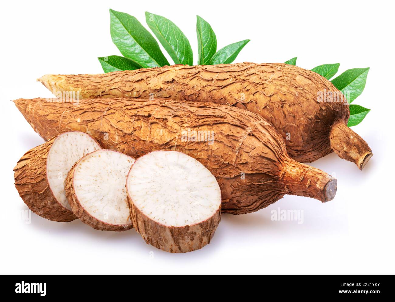Cassava tubers with leaves and cassava slices isolated on white ...