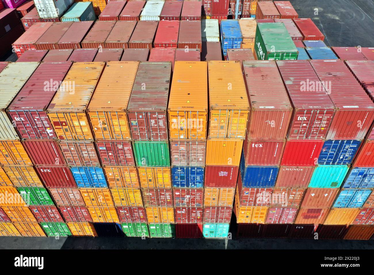 A bunch of intermodal containers of various colors ready to be loaded ...