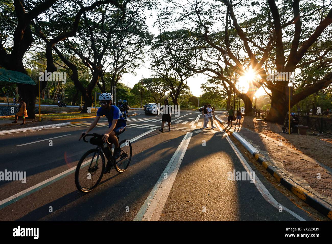 April 19, 2024, Quezon City, Metro Manila, The Philippines: A cyclist ...
