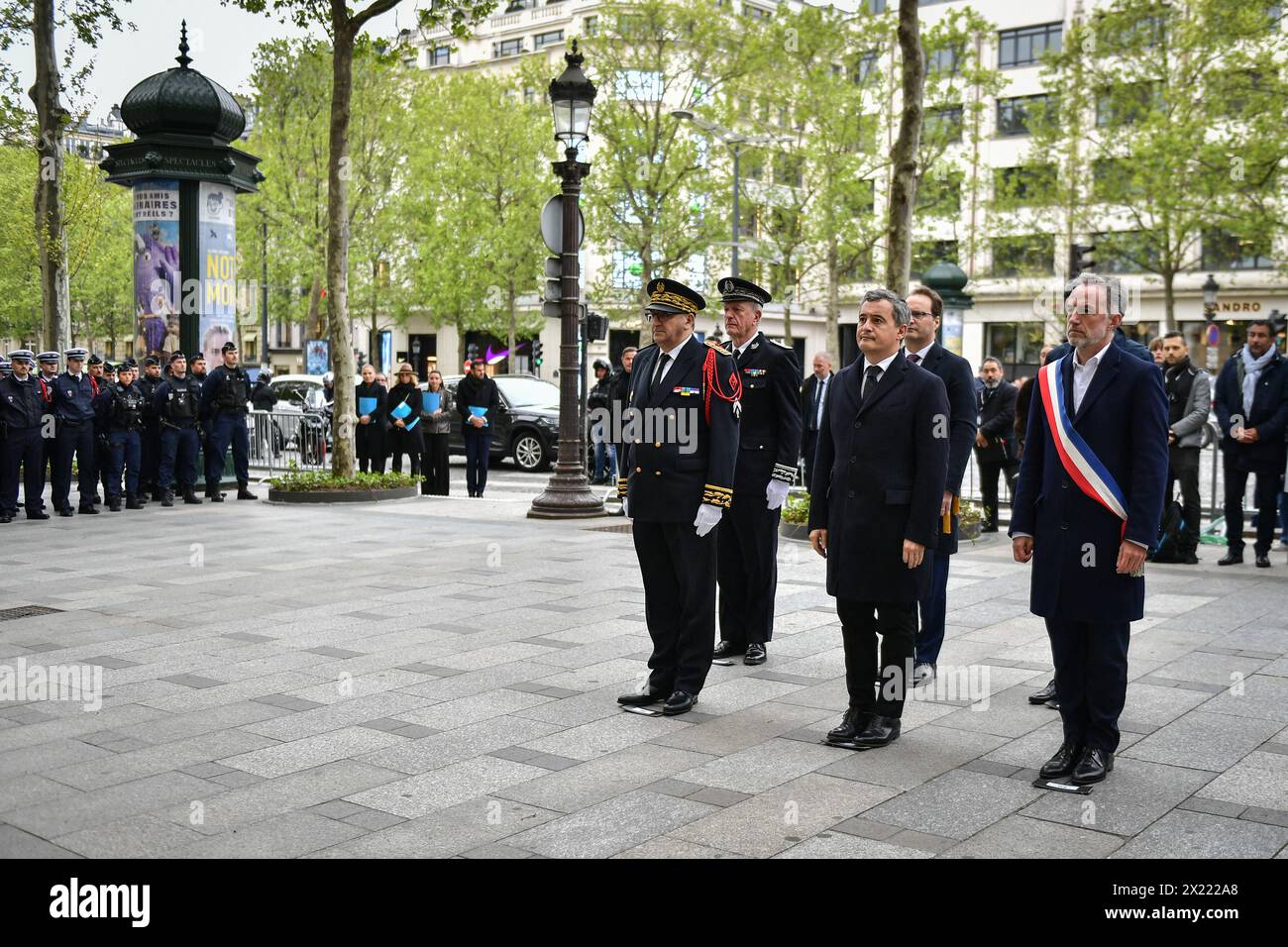 French Interior and Overseas Minister Gerald Darmanin (C) stands in ...