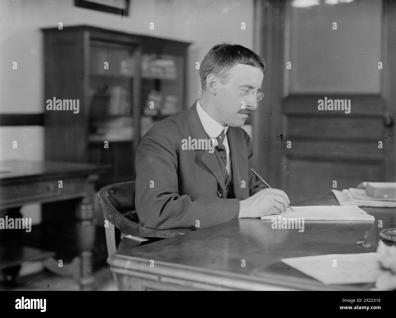 Man sitting glass desk Black and White Stock Photos & Images - Alamy