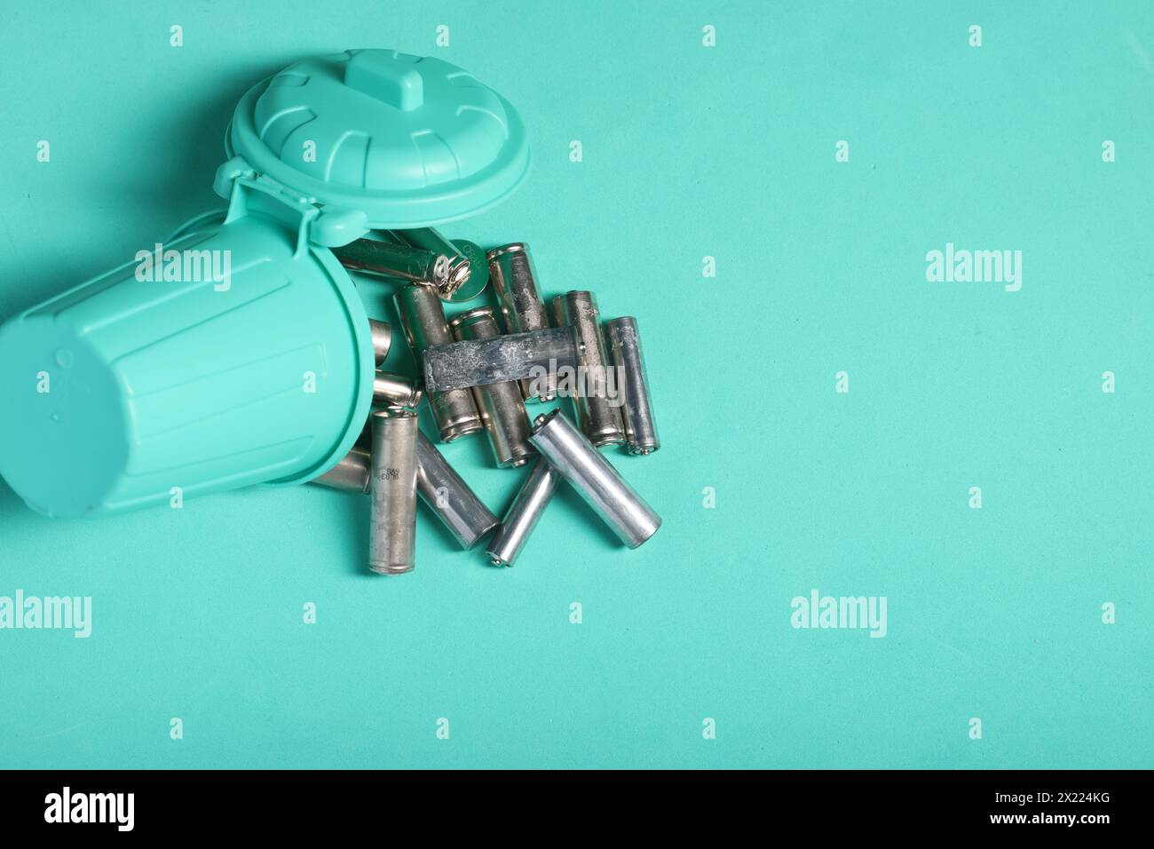 Symbolic image of electronic waste: mini trash can filled with used ...