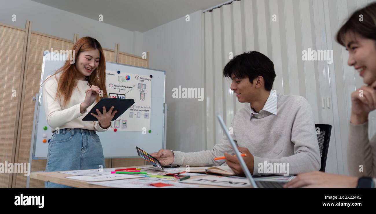 Ux Developer And Ui Designer Presenting Mobile App Interface Design On Whiteboard In Meeting At