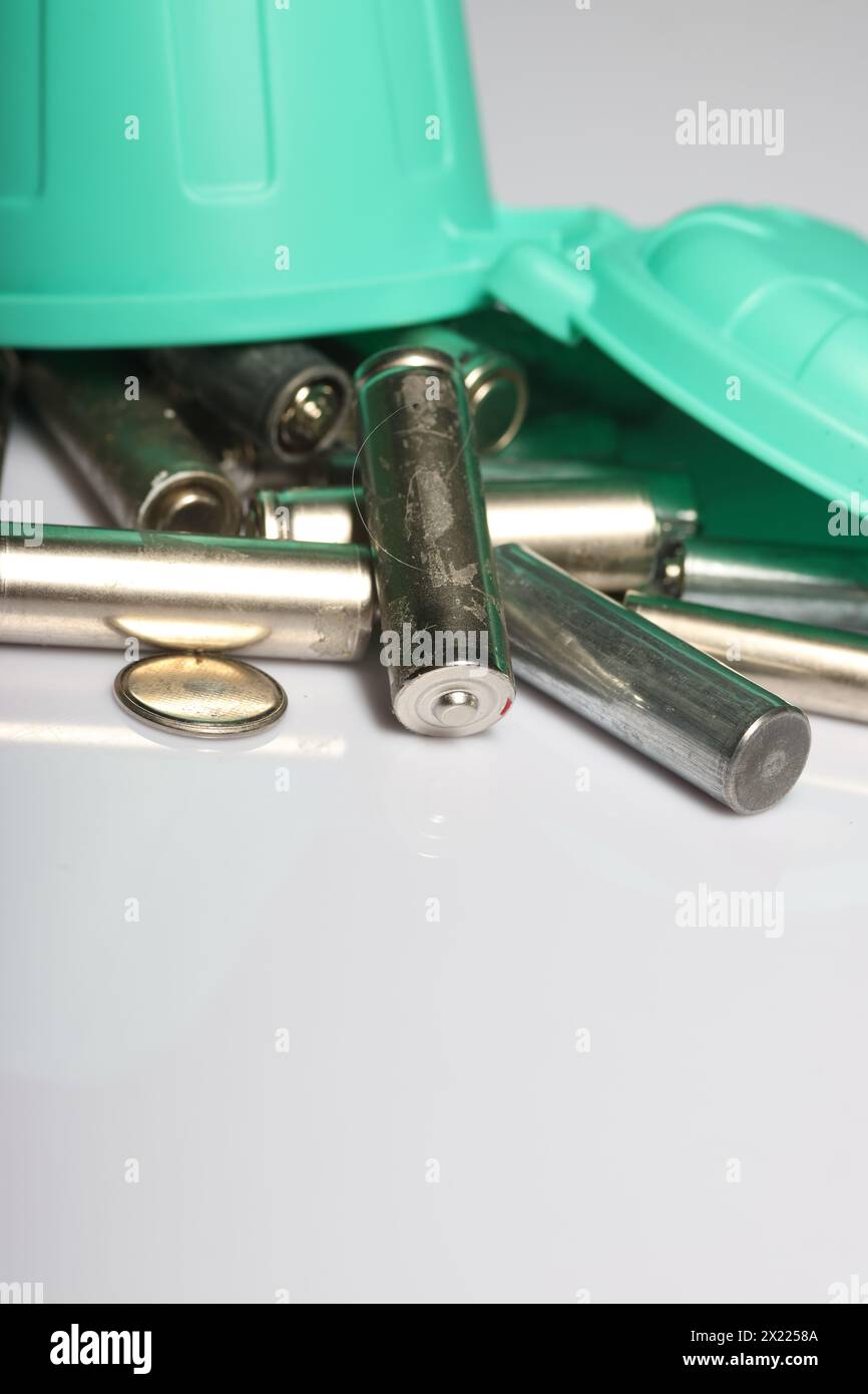 Miniature scene with a powerful message: old finger batteries arranged ...