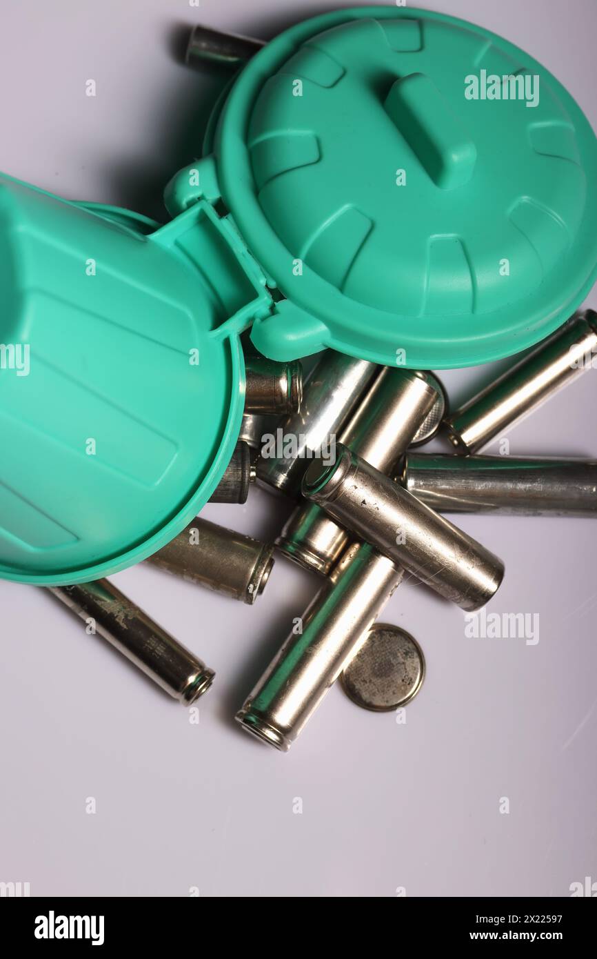 Thought-provoking photo of finger batteries in a mini bin, showcasing ...