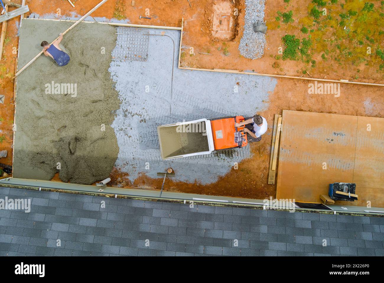 Self dumping track concrete buggy is used to pour wet cement into ...