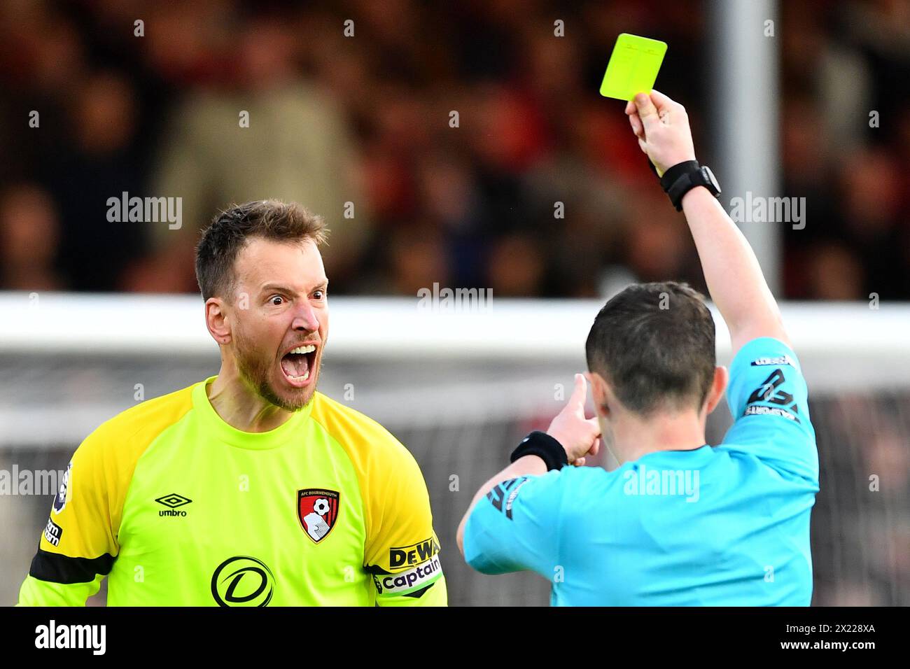 Neto of AFC Bournemouth is shown a yellow card by referee Tony ...