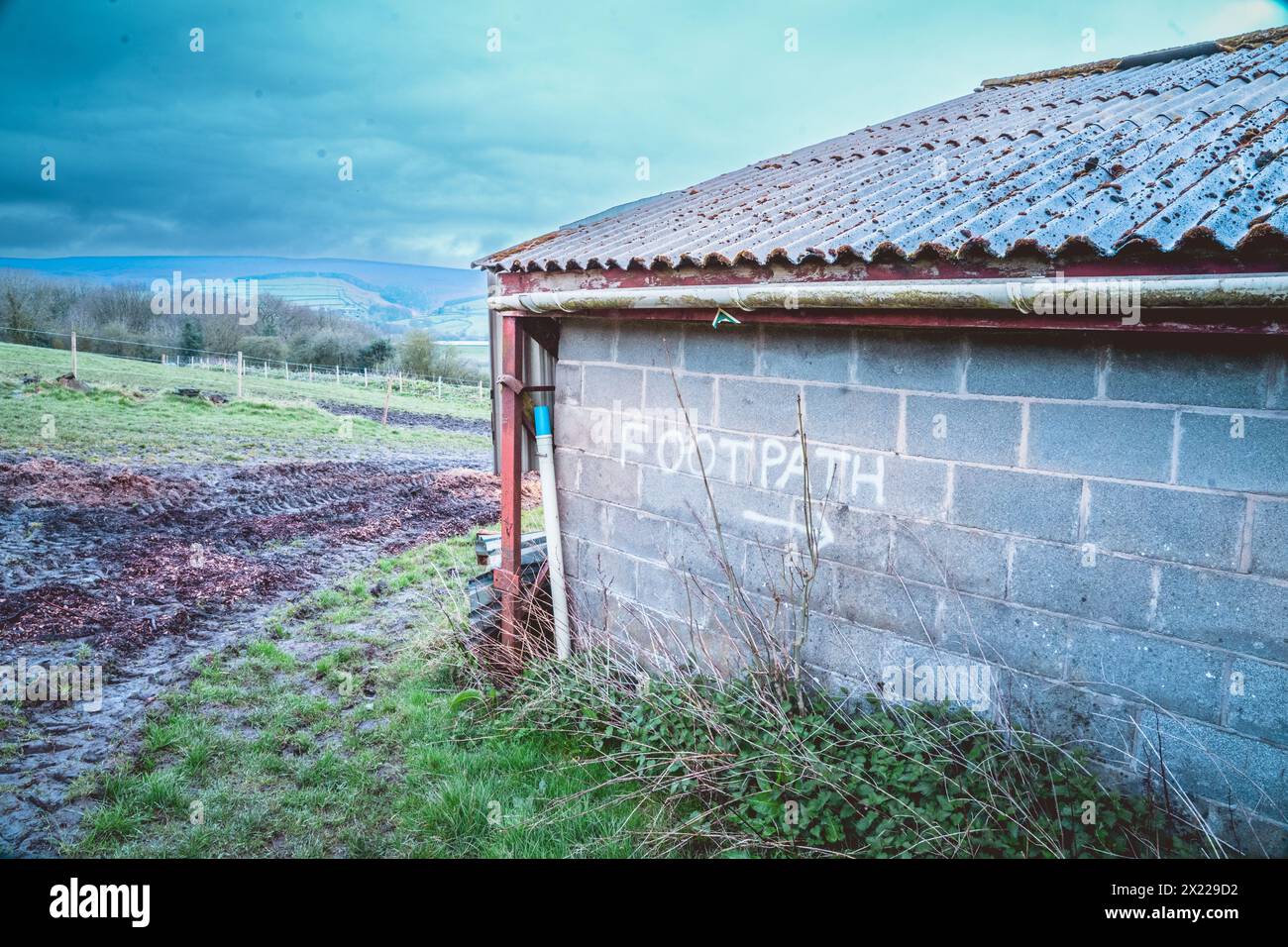 Footpath sign on building Stock Photo - Alamy