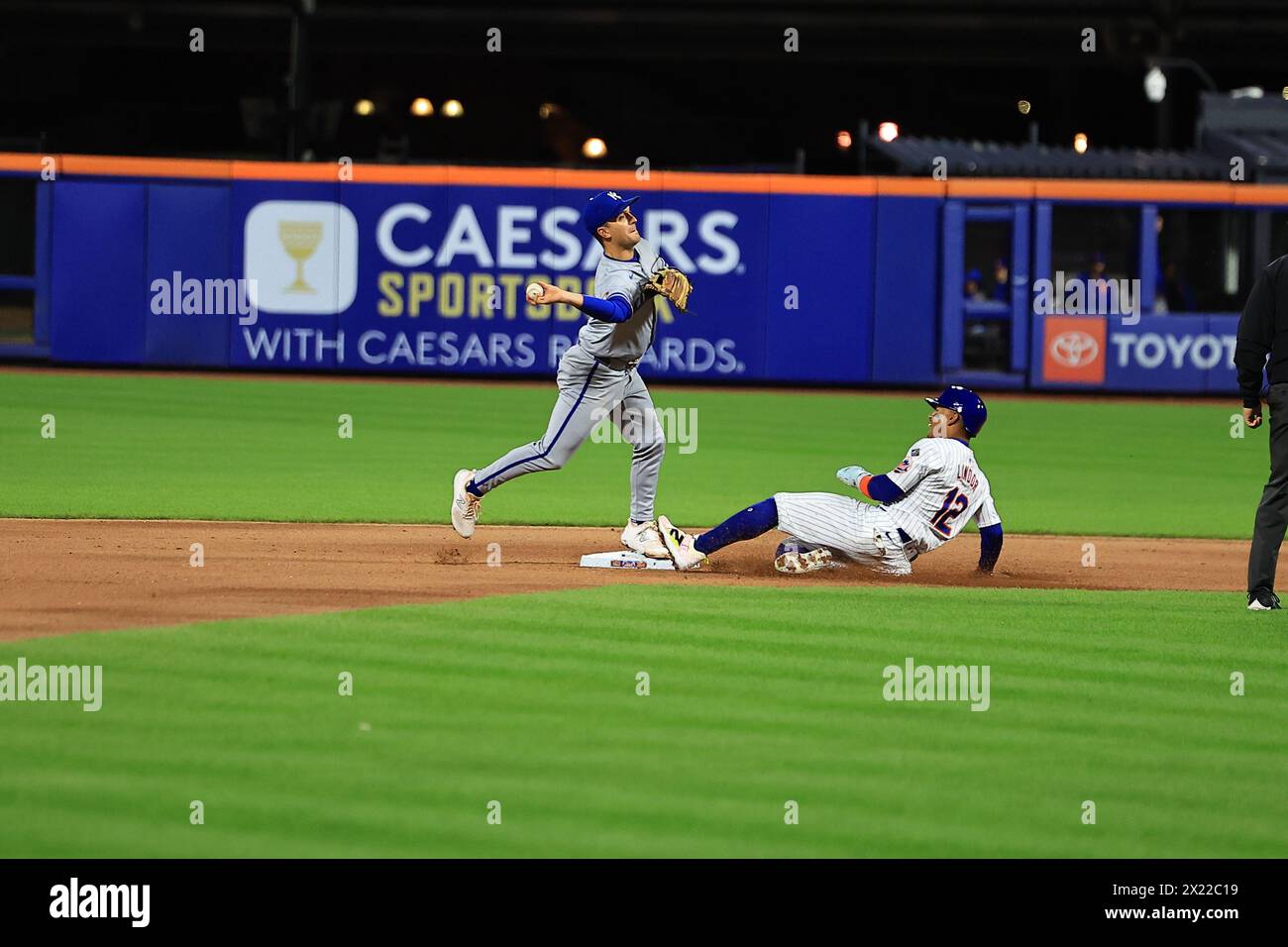 Kansas City Royals 2B Adam Frazier #26 fields and throws to complete ...
