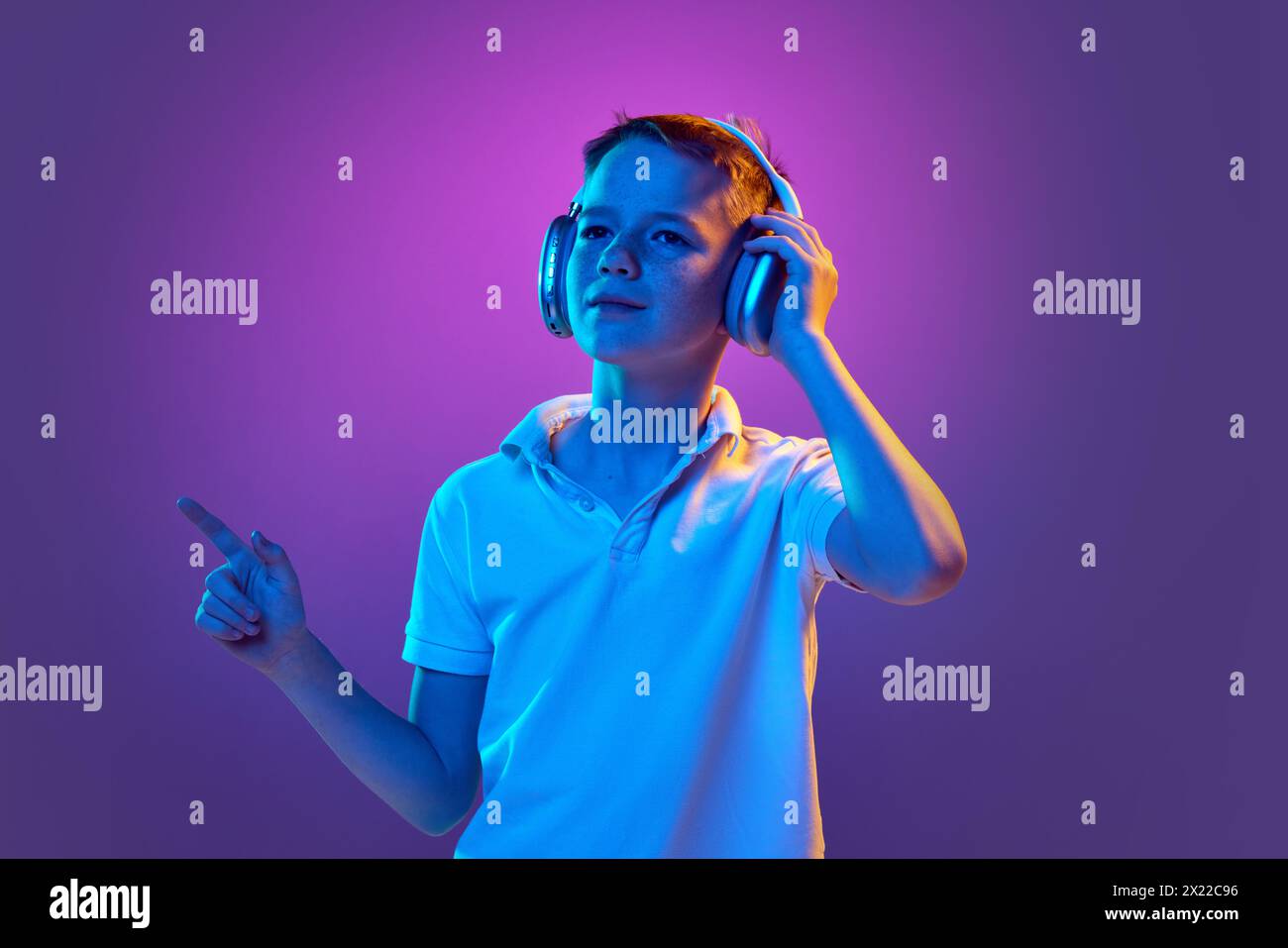 Love rhythm. Young boy with cute freckles listening music in headphones ...