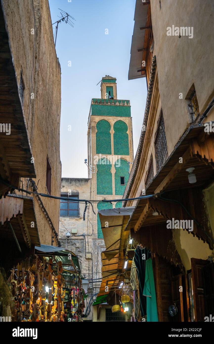 The minaret towers over the ancient Fez Medina as evening approaches ...
