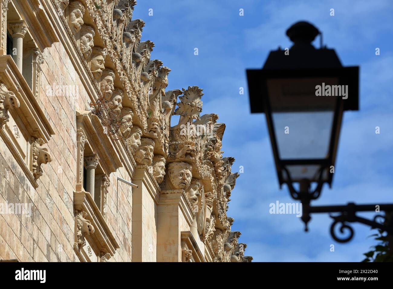 Details (human faces) of Impellizzeri Palace, located along Via ...
