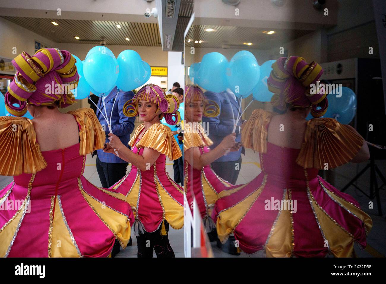 Artists of the Metropolitan Circus hold colorful balloons before ...